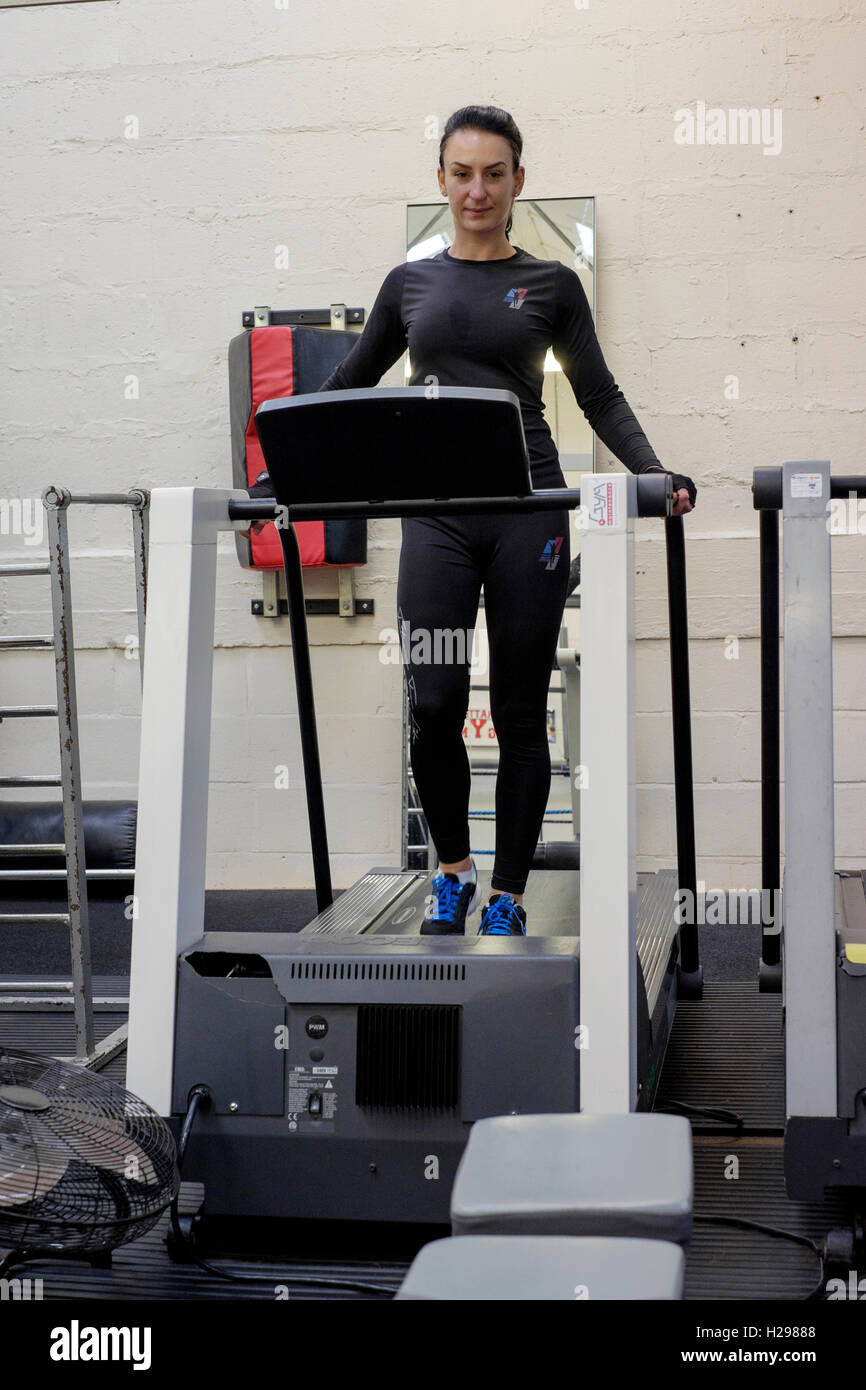 young female working out on a treadmill in a gym england uk Stock Photo ...
