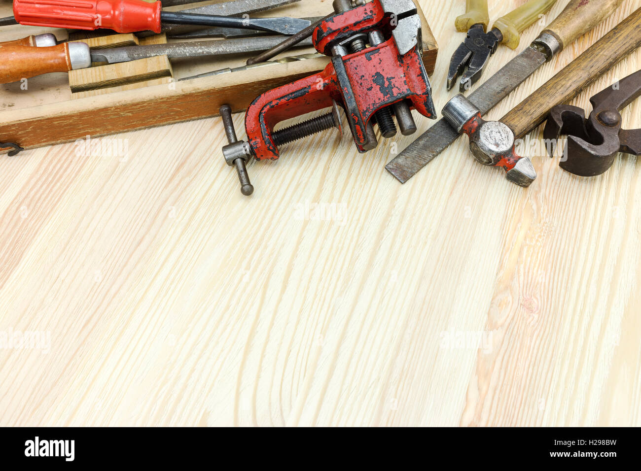 set of old tools for house renovation and construction on wooden table ...