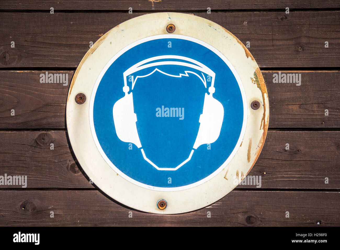 blue ear muff symbol on wood texture Stock Photo - Alamy
