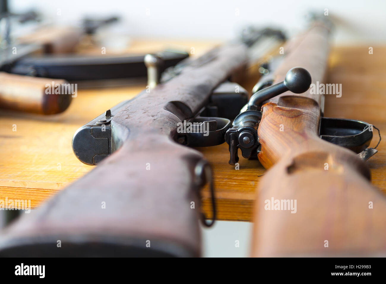 old carabiner weapons on a table Stock Photo - Alamy