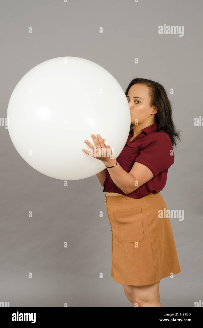 Woman inflating balloon hi-res stock photography and images - Alamy