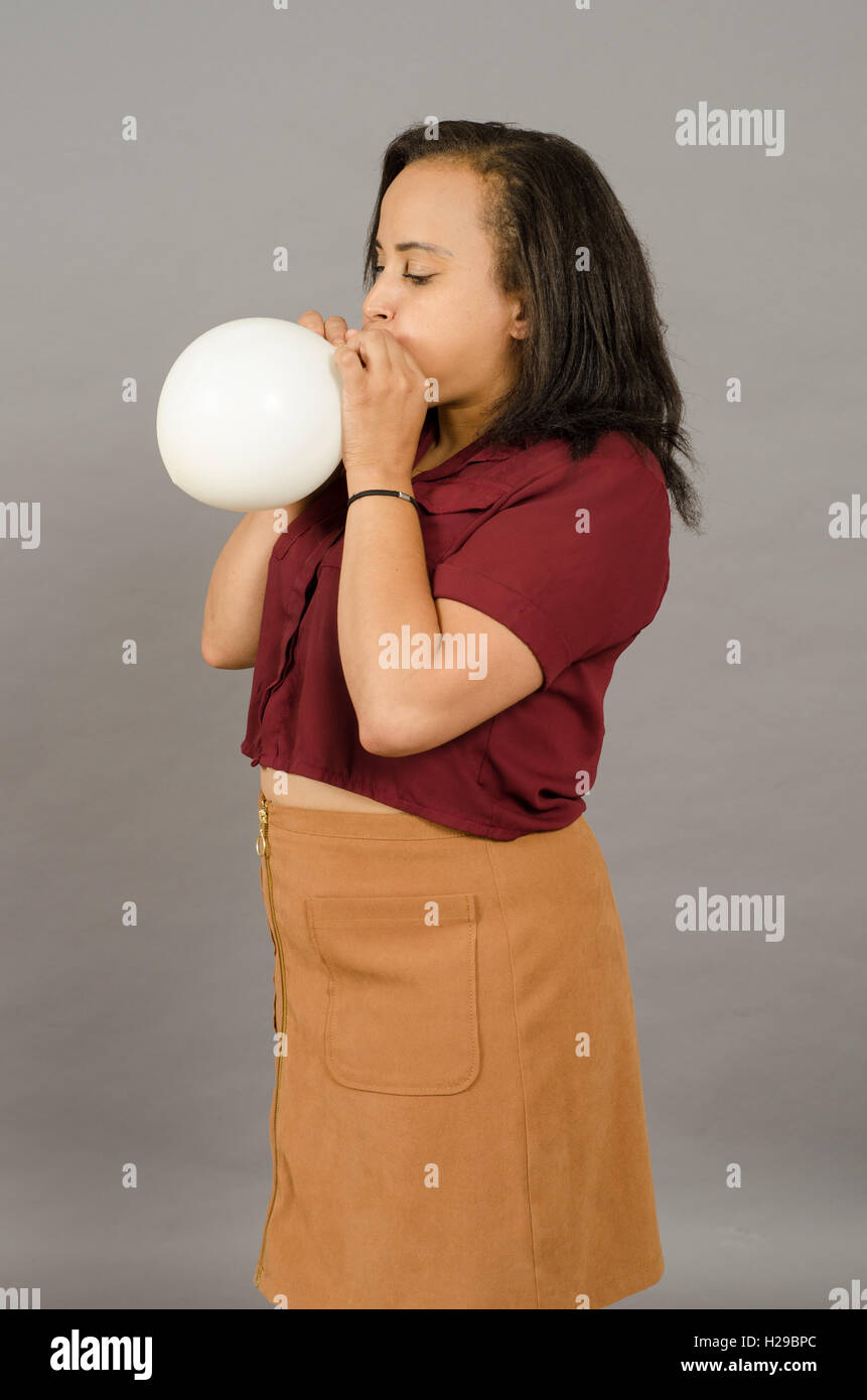 Blowing balloon adult hi-res stock photography and images - Alamy
