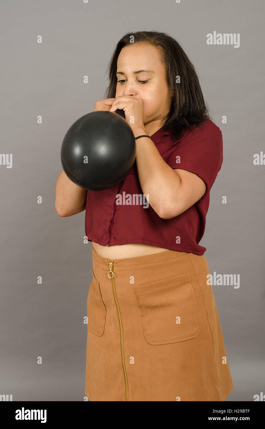 Adult female blowing up large hi-res stock photography and images - Alamy