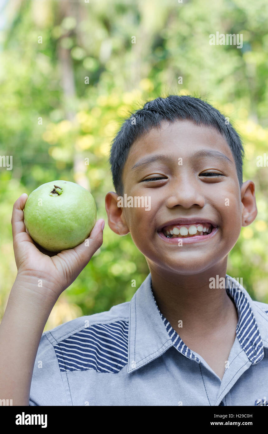 Asian Child Enjoy with The Fresh Guava Stock Photo - Alamy