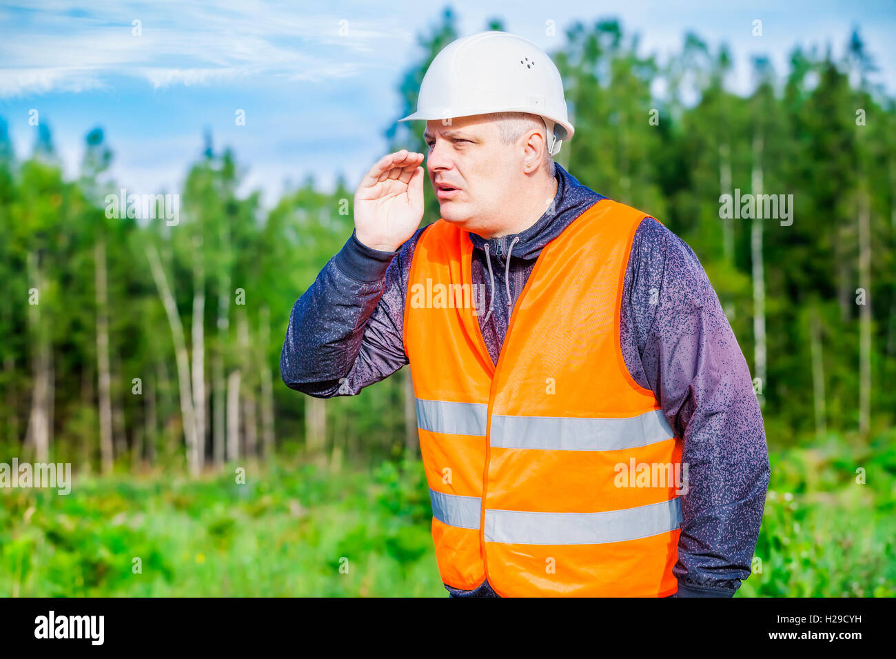 Forest worker screaming in the woods Stock Photo - Alamy