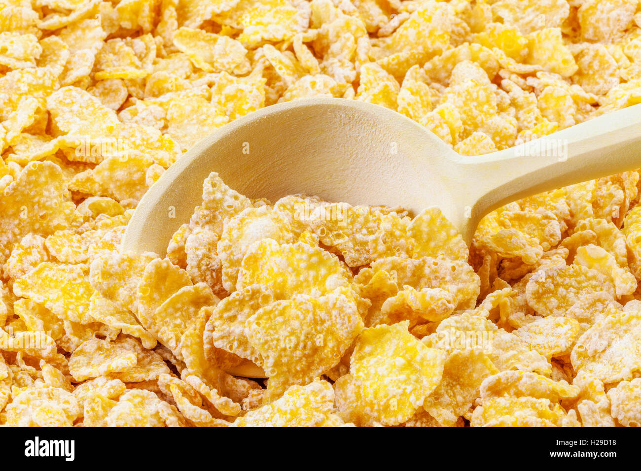 Cornflakes with wooden spoon Stock Photo - Alamy