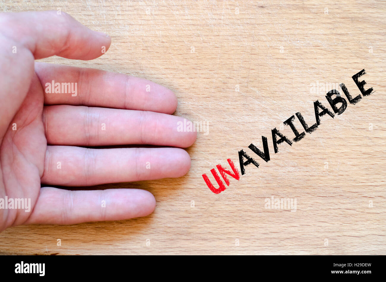 Human hand over wooden background and unavailable text concept Stock ...