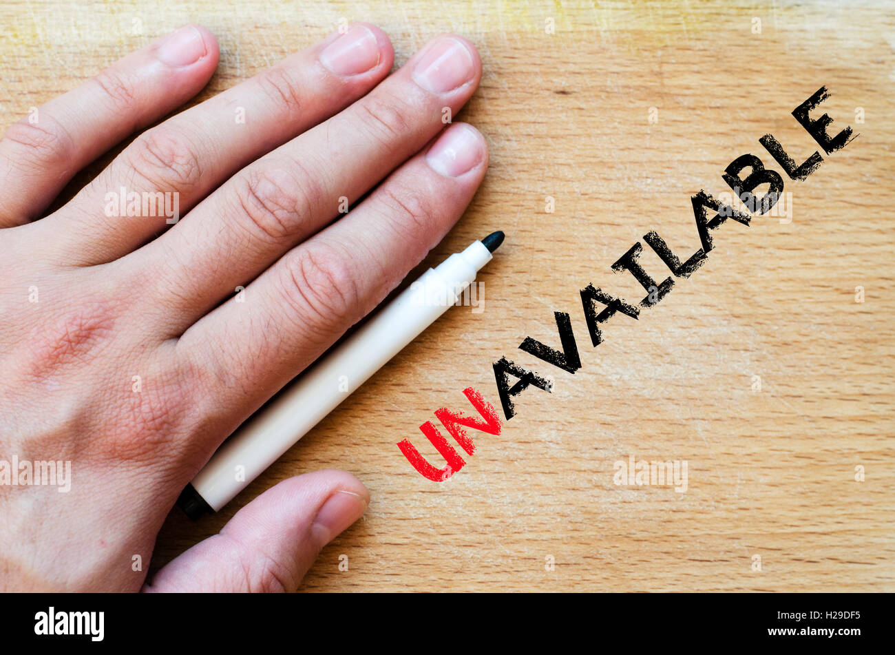Human hand over wooden background and unavailable text concept Stock ...