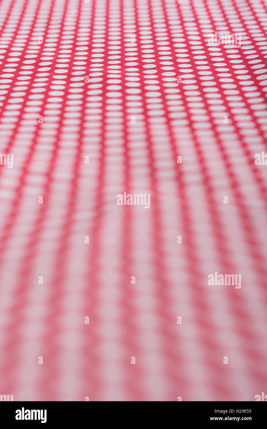 Abstract red-white polka dot cotton material - dots receding into ...