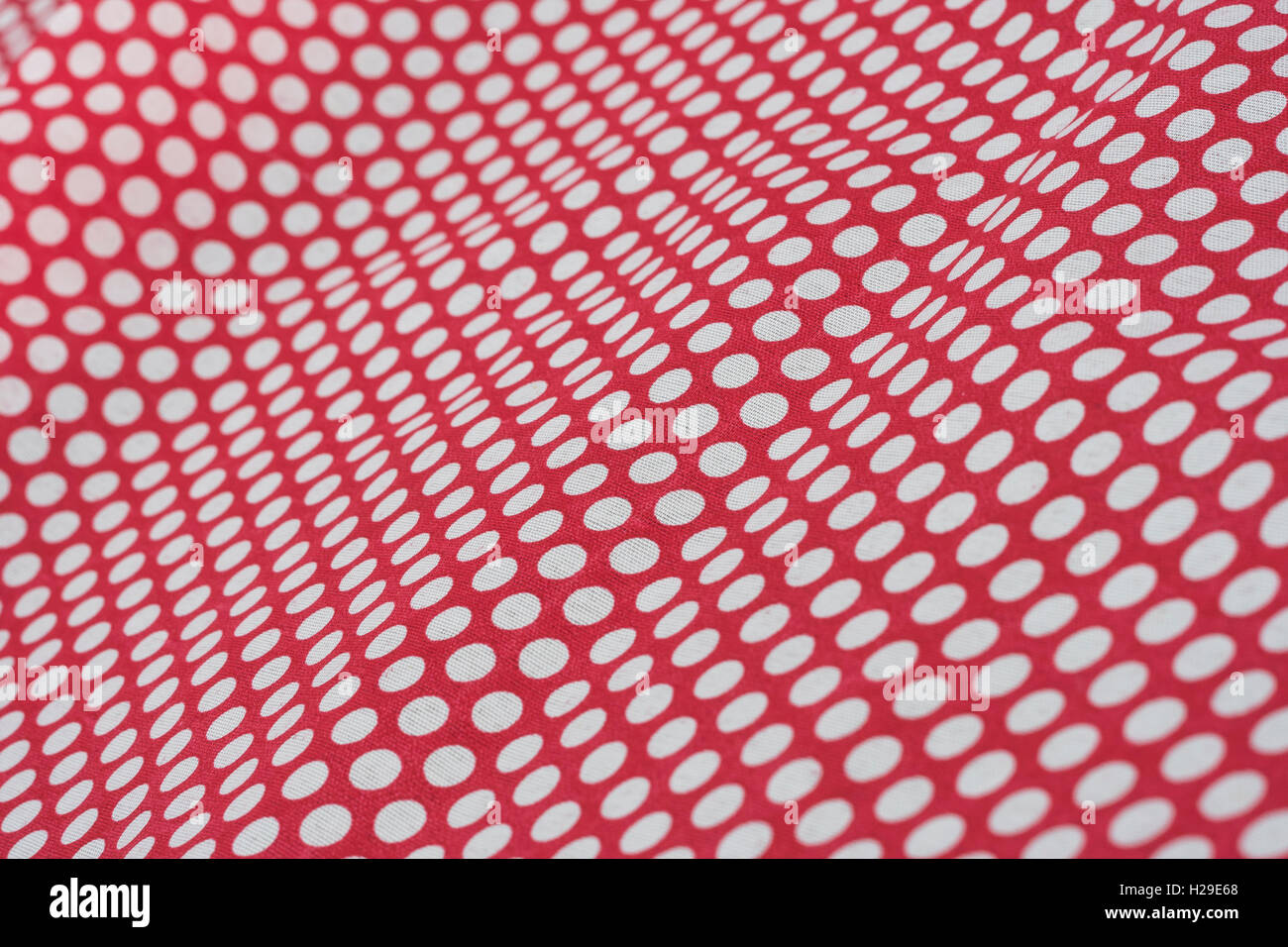 Abstract red-white polka dot cotton material. Concept 'International ...