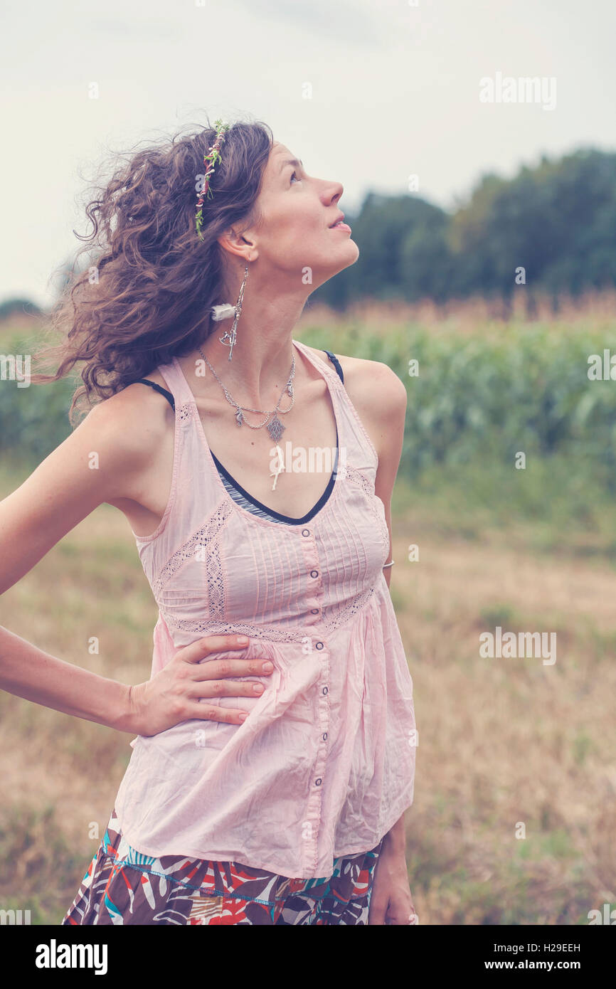 Beautiful woman in nature waiting for the rain Stock Photo - Alamy
