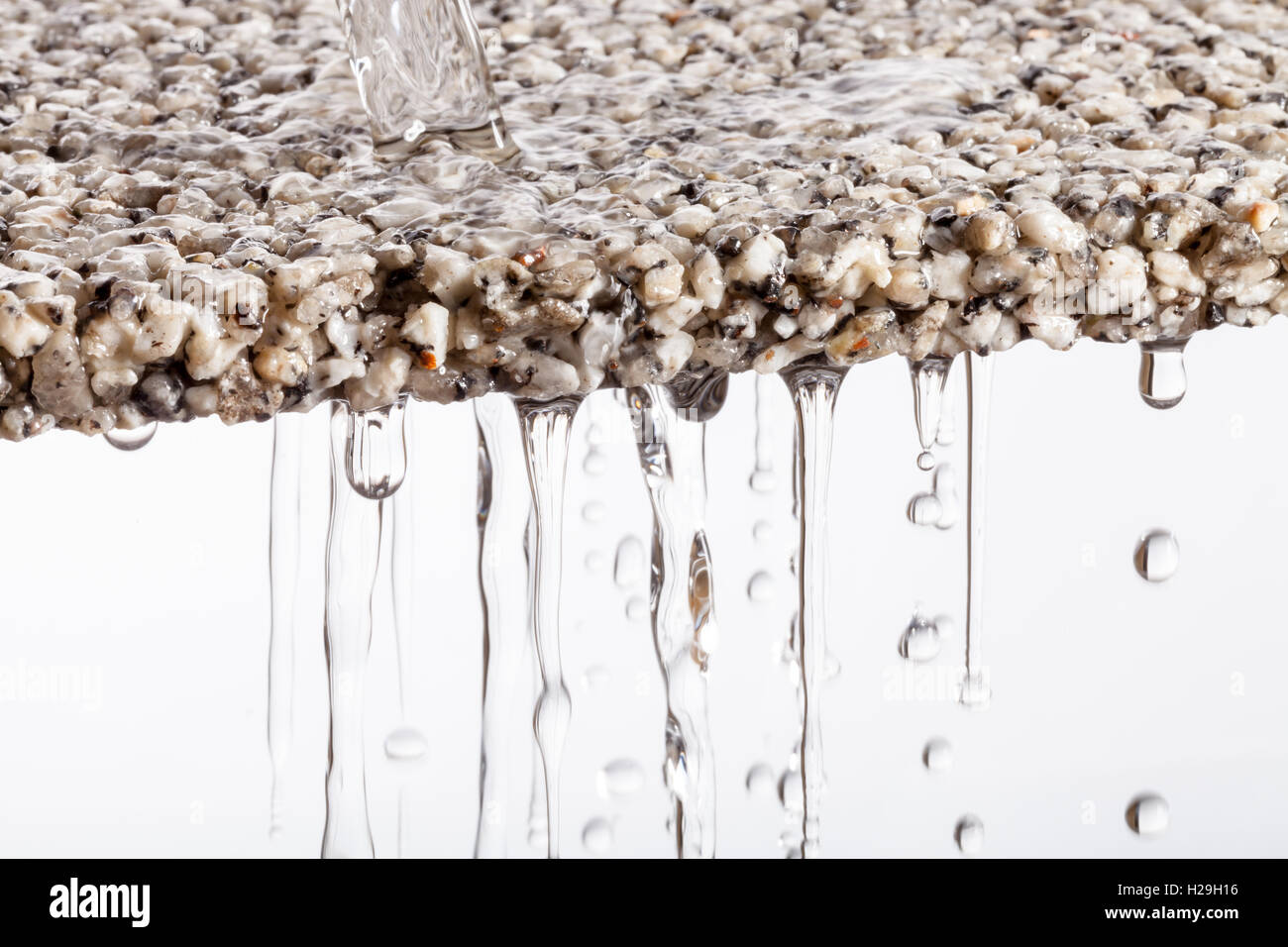 Stone chip surface with water pouring through Stock Photo - Alamy