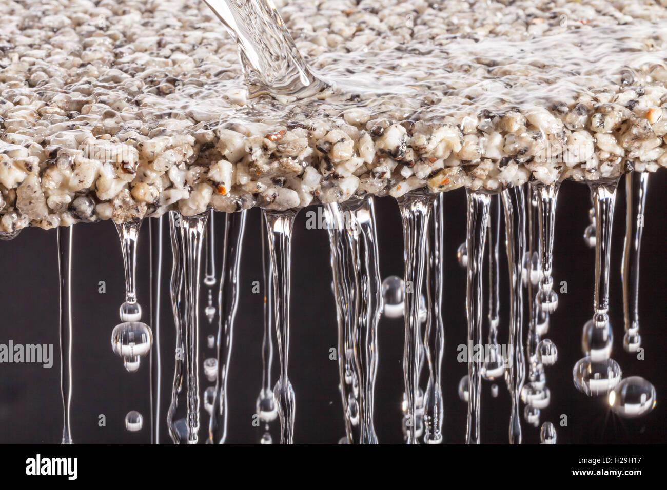 Stone chip surface with water pouring through Stock Photo - Alamy