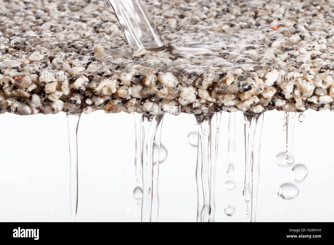 Stone chip surface with water pouring through Stock Photo - Alamy