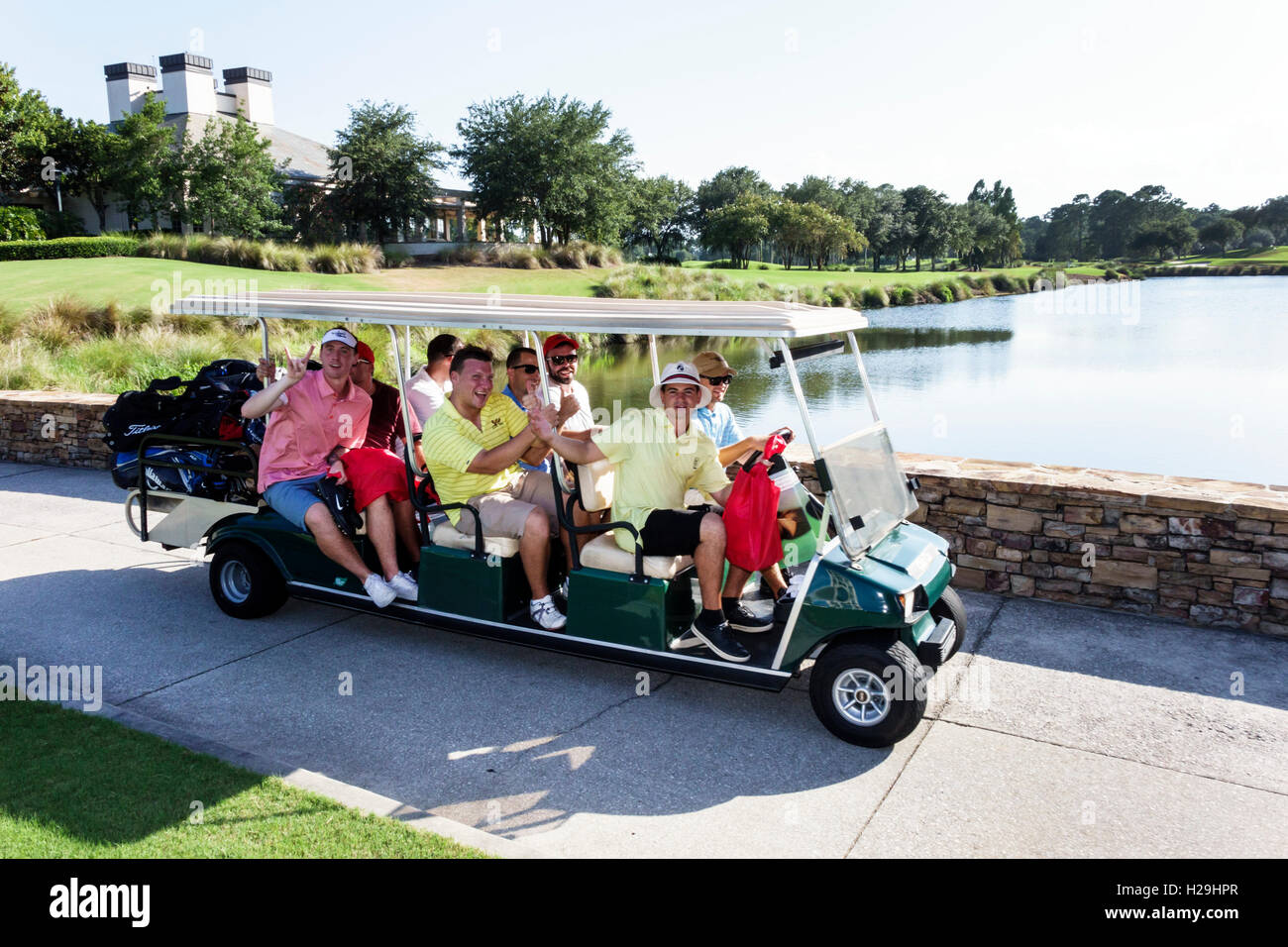 Man in a golf cart hi-res stock photography and images - Alamy