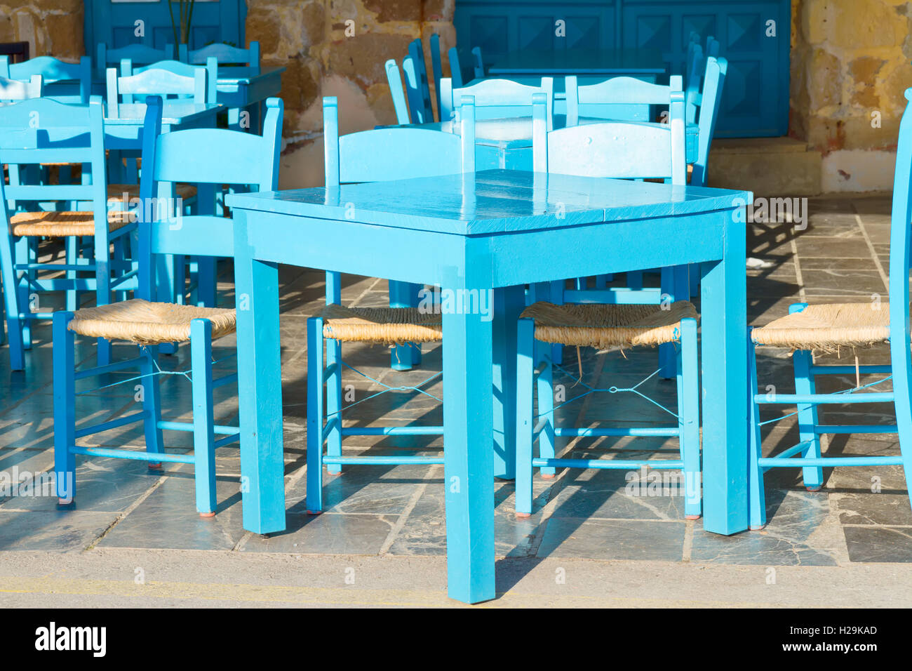 cafe with blue chairs, Crete, Greece Stock Photo - Alamy