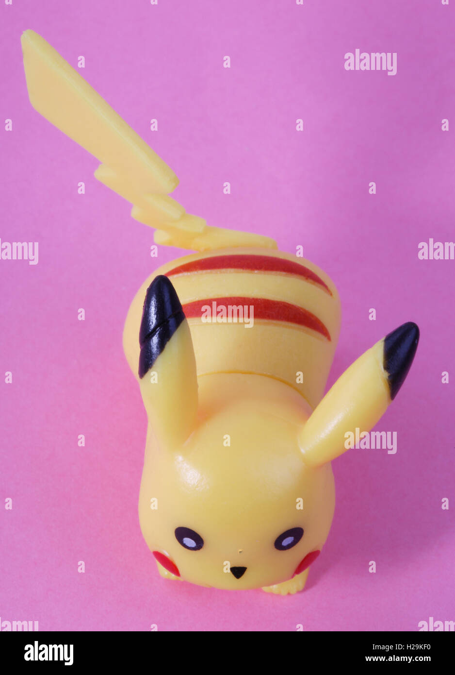 plastic toy on pink background Stock Photo - Alamy