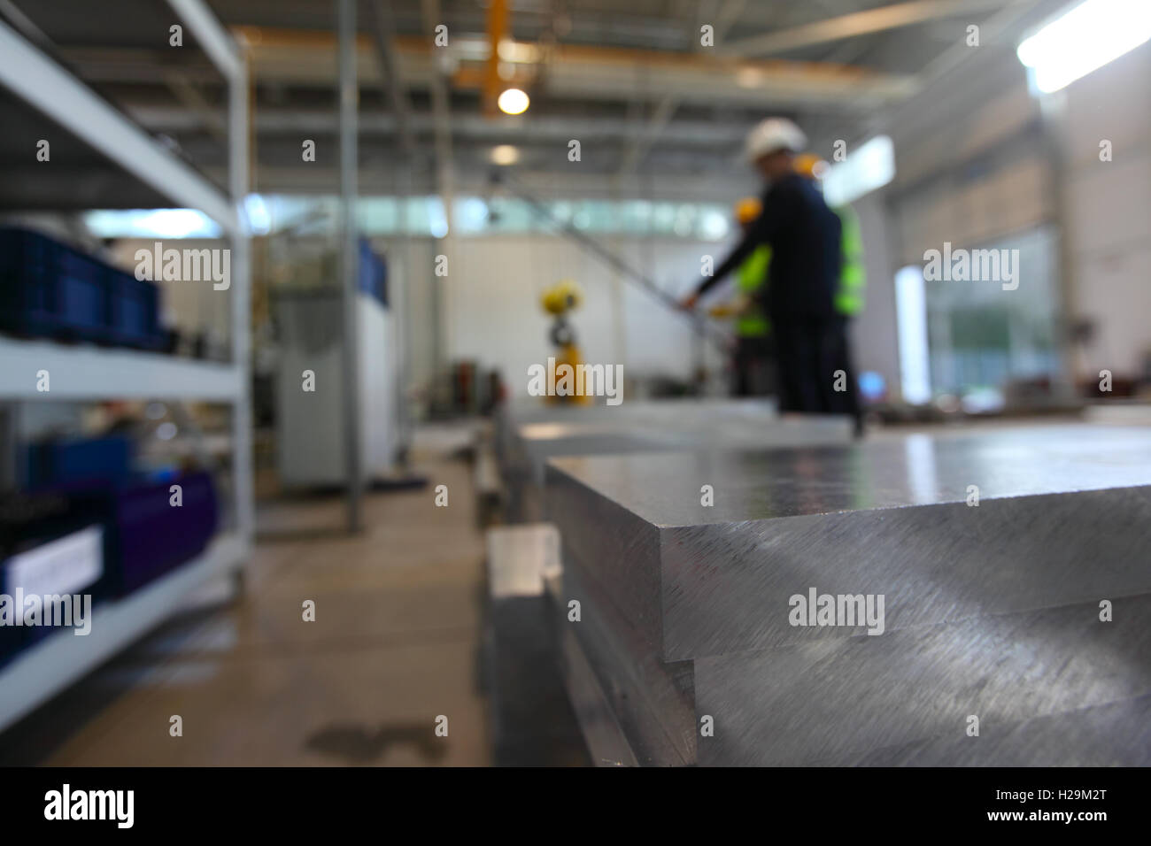 Stack of aluminium billets at CNC machine shop Stock Photo - Alamy
