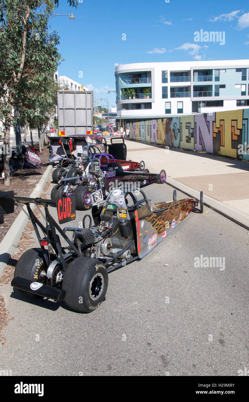 A row of custom go carts on display at the billy cart race festival in ...