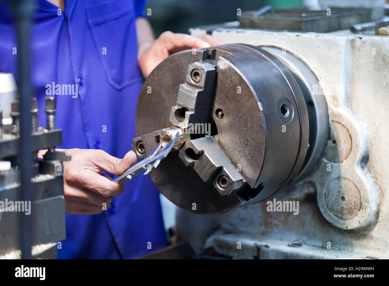 Milling machine operator working in factory workshop Stock Photo - Alamy