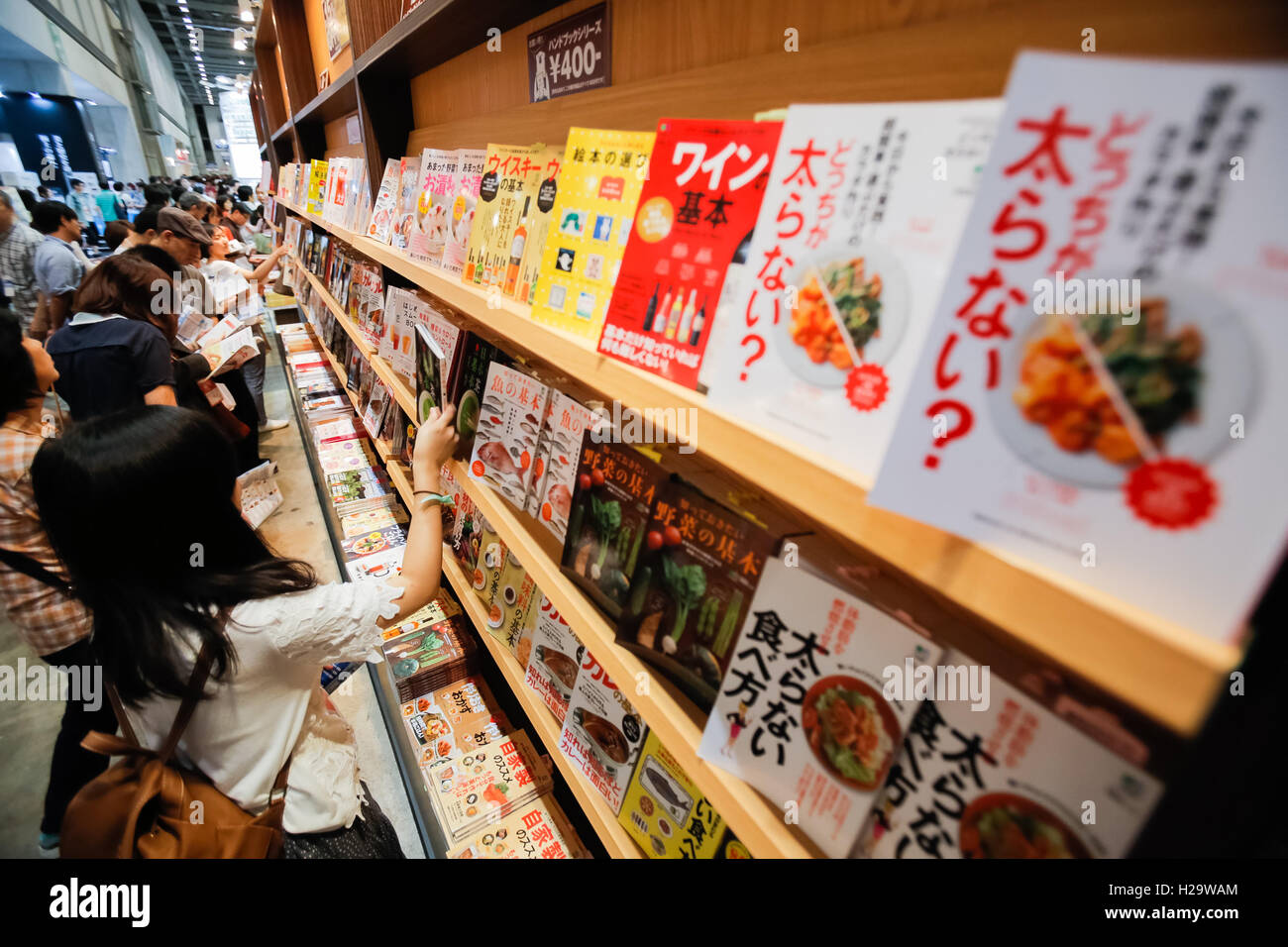 Visitors look at the latest products form publishing industry during ...