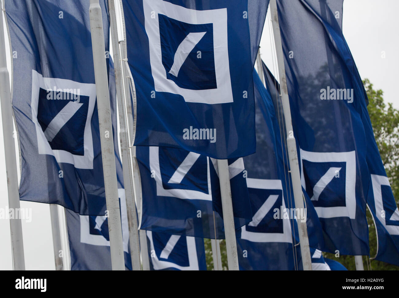 Flags featuring the corporate logo of Deutsche Bank flying at the ...