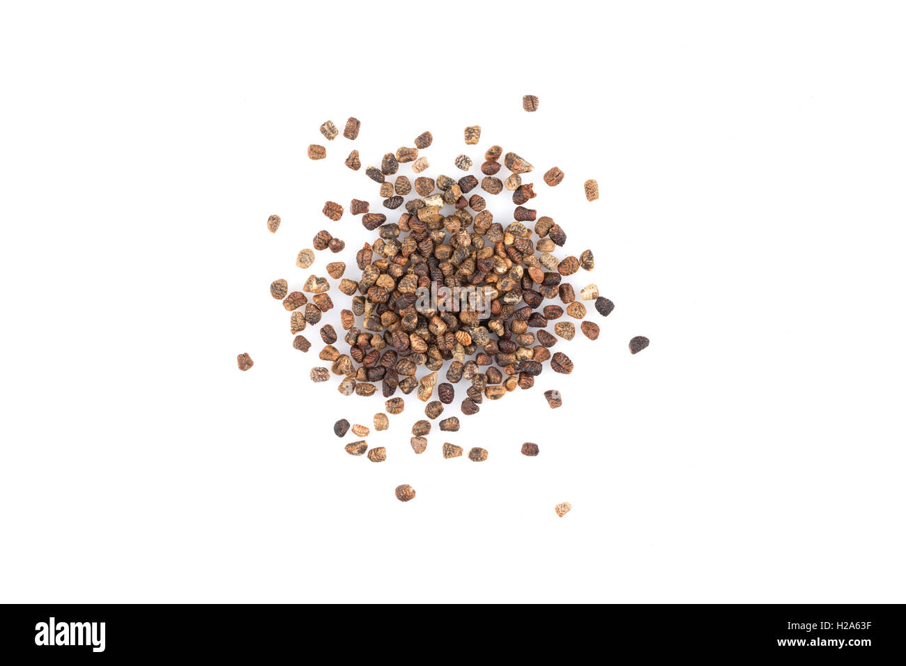 Decorticated cardamom seeds pile on a white background Stock Photo - Alamy