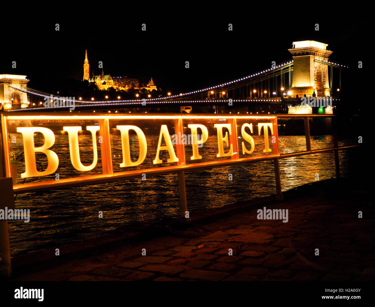 Illuminated sign infront of Budapest cityscape Stock Photo - Alamy