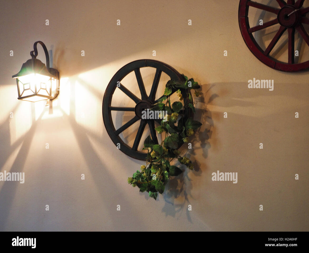 Wooden Wheels wall display Stock Photo - Alamy