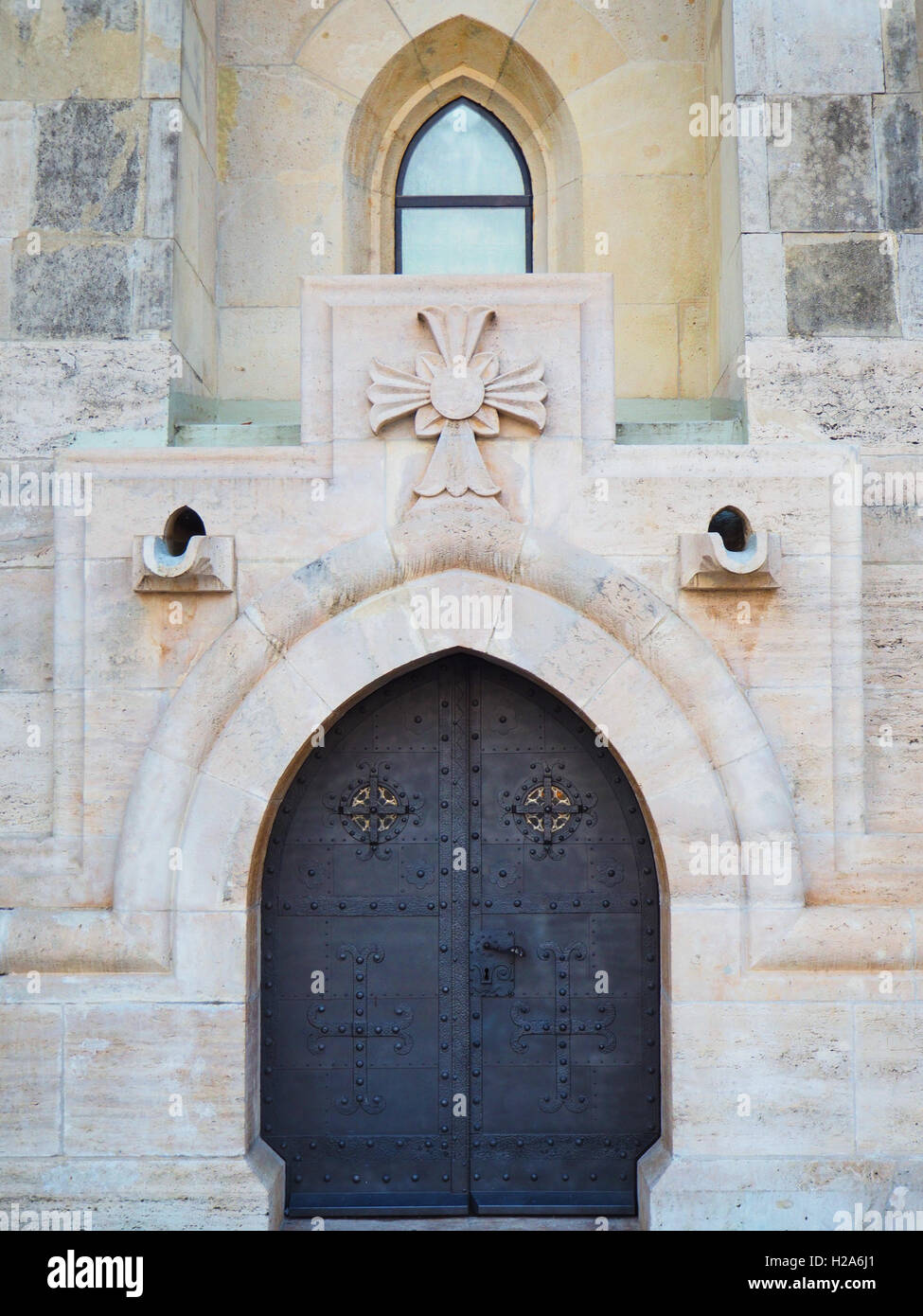 Symmetrical view of iron church doors Stock Photo - Alamy