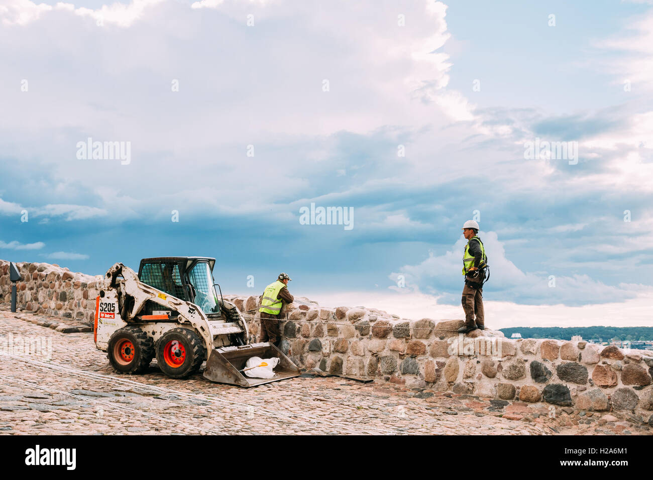 Vilnius, Lithuania - July 04, 2016: Two Workers Men With Mini Dozer At ...