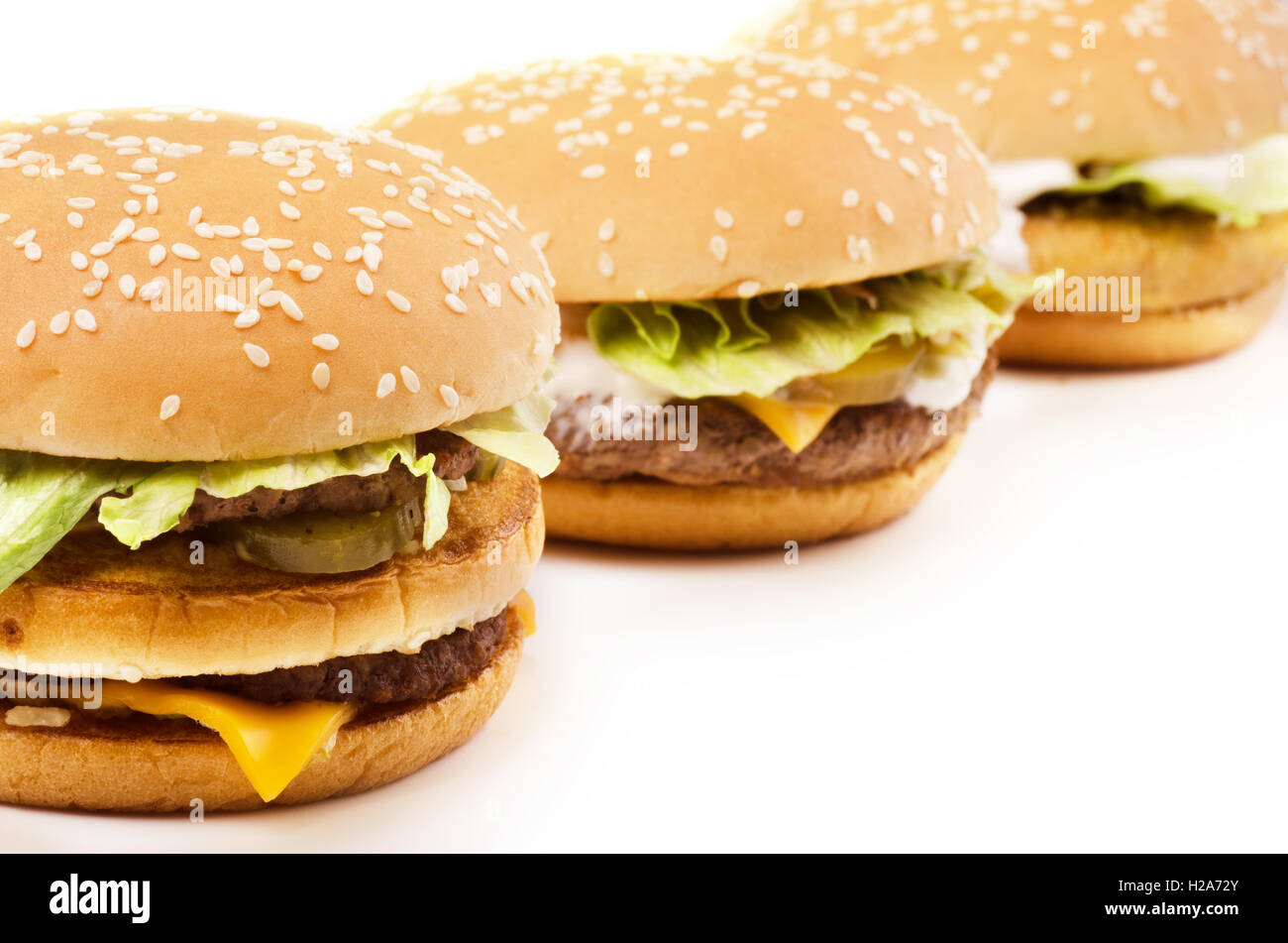 Burgers in a row isolated on a white background Stock Photo - Alamy