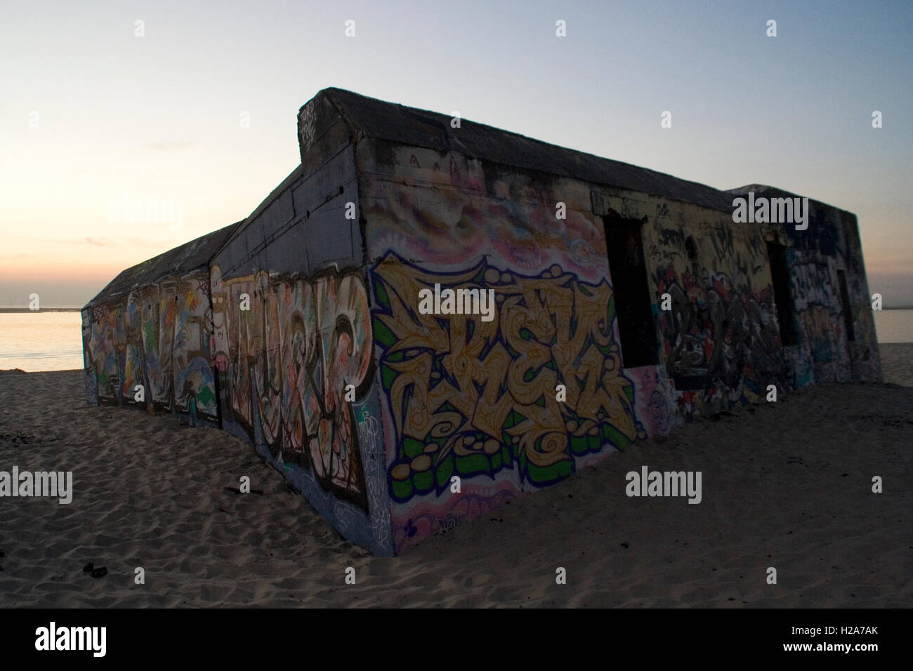 Graffiti on beach Stock Photo - Alamy