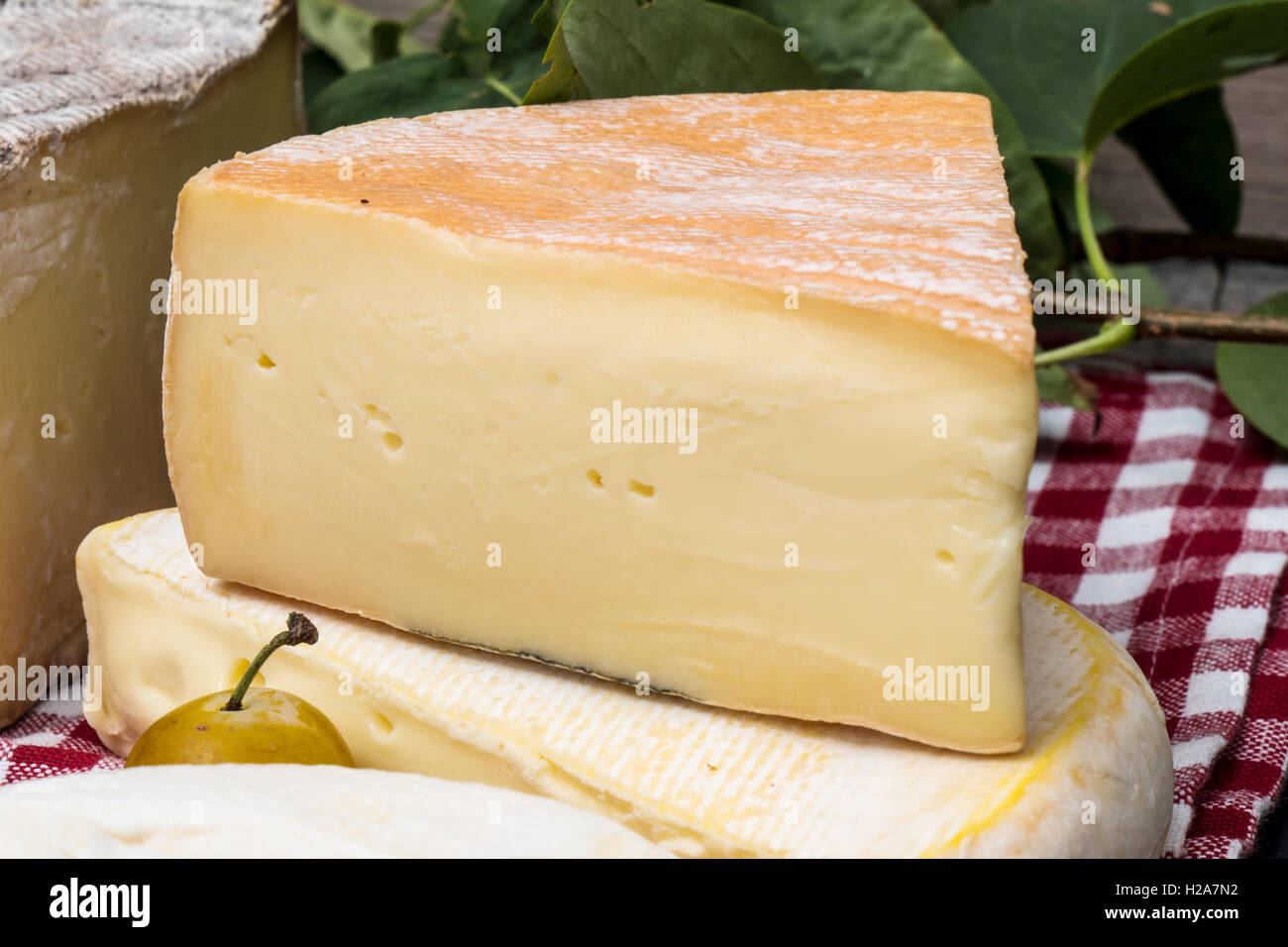 piece of cheese french of mountains and Reblochon Stock Photo - Alamy
