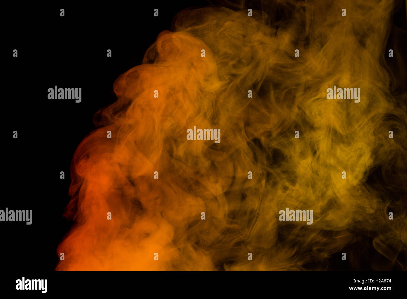 Abstract red yellow water vapor on a black background. Texture. Design ...