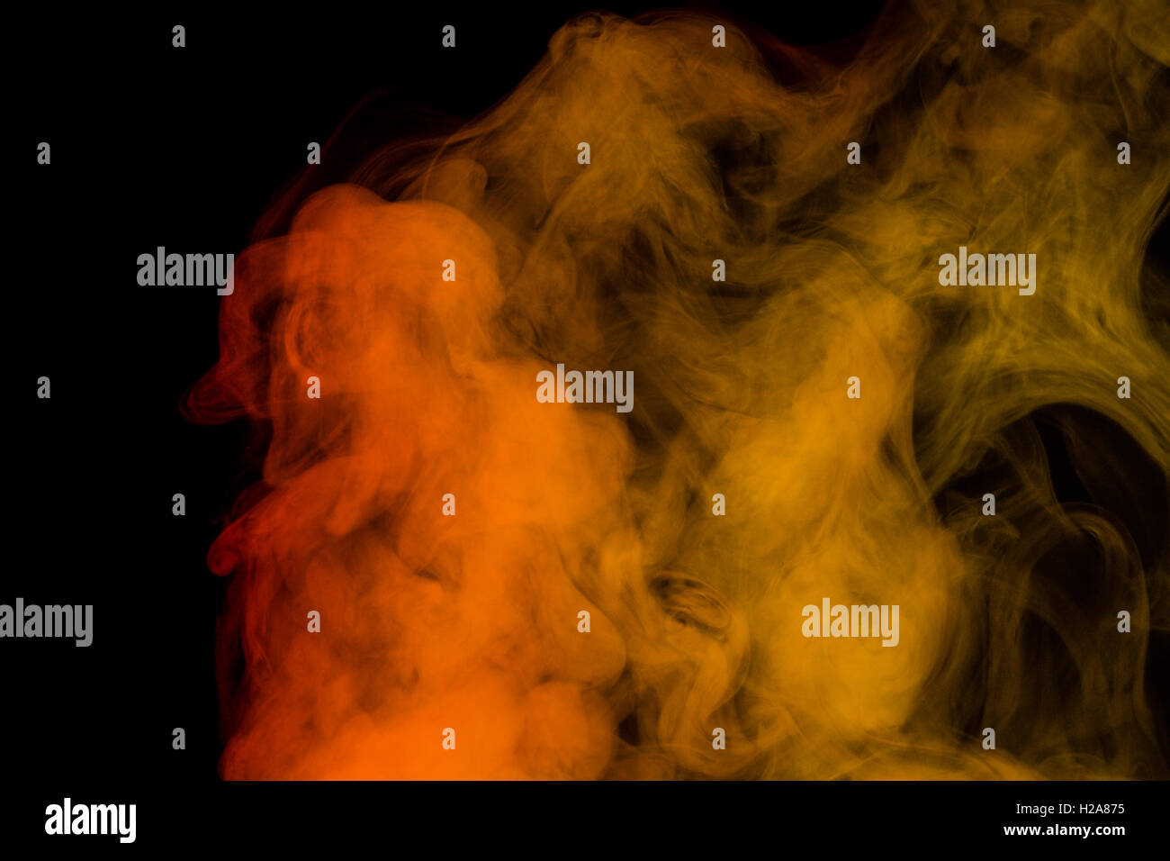 Abstract red yellow water vapor on a black background. Texture. Design ...