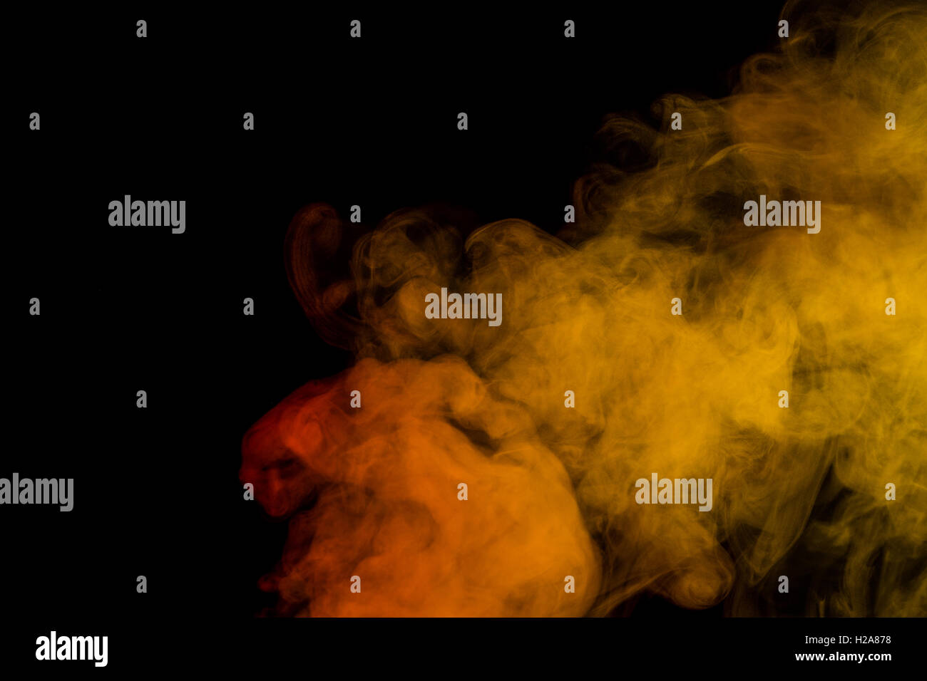 Abstract red yellow water vapor on a black background. Texture. Design ...