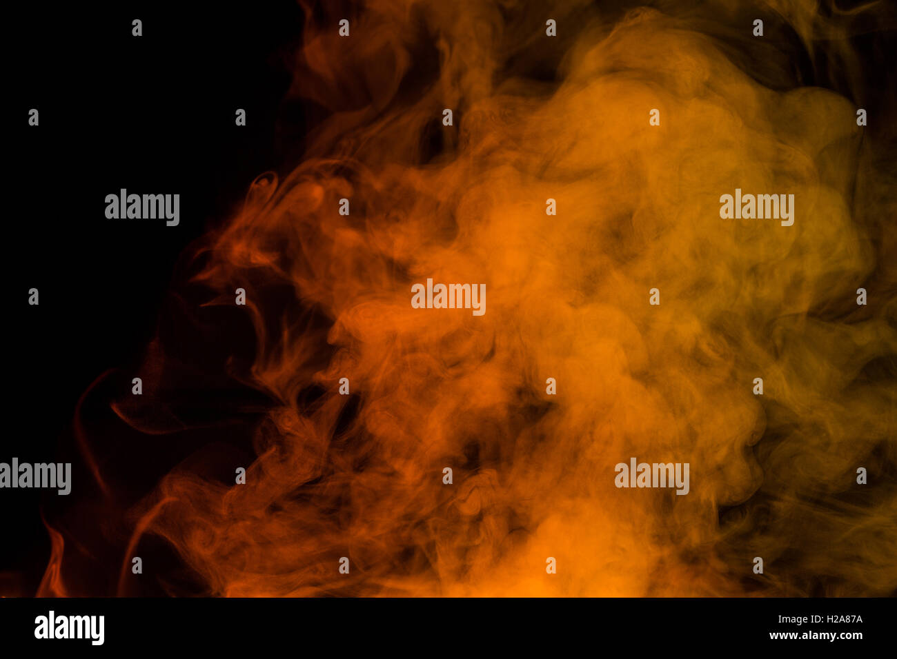Abstract red yellow water vapor on a black background. Texture. Design ...