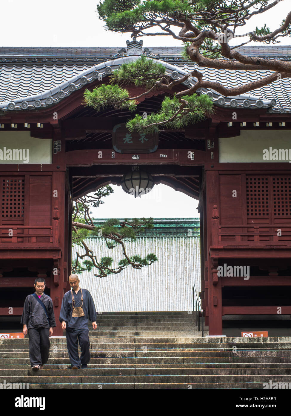two buddhist priests walking down stairs, Furomon Gate, Gokokuji temple ...