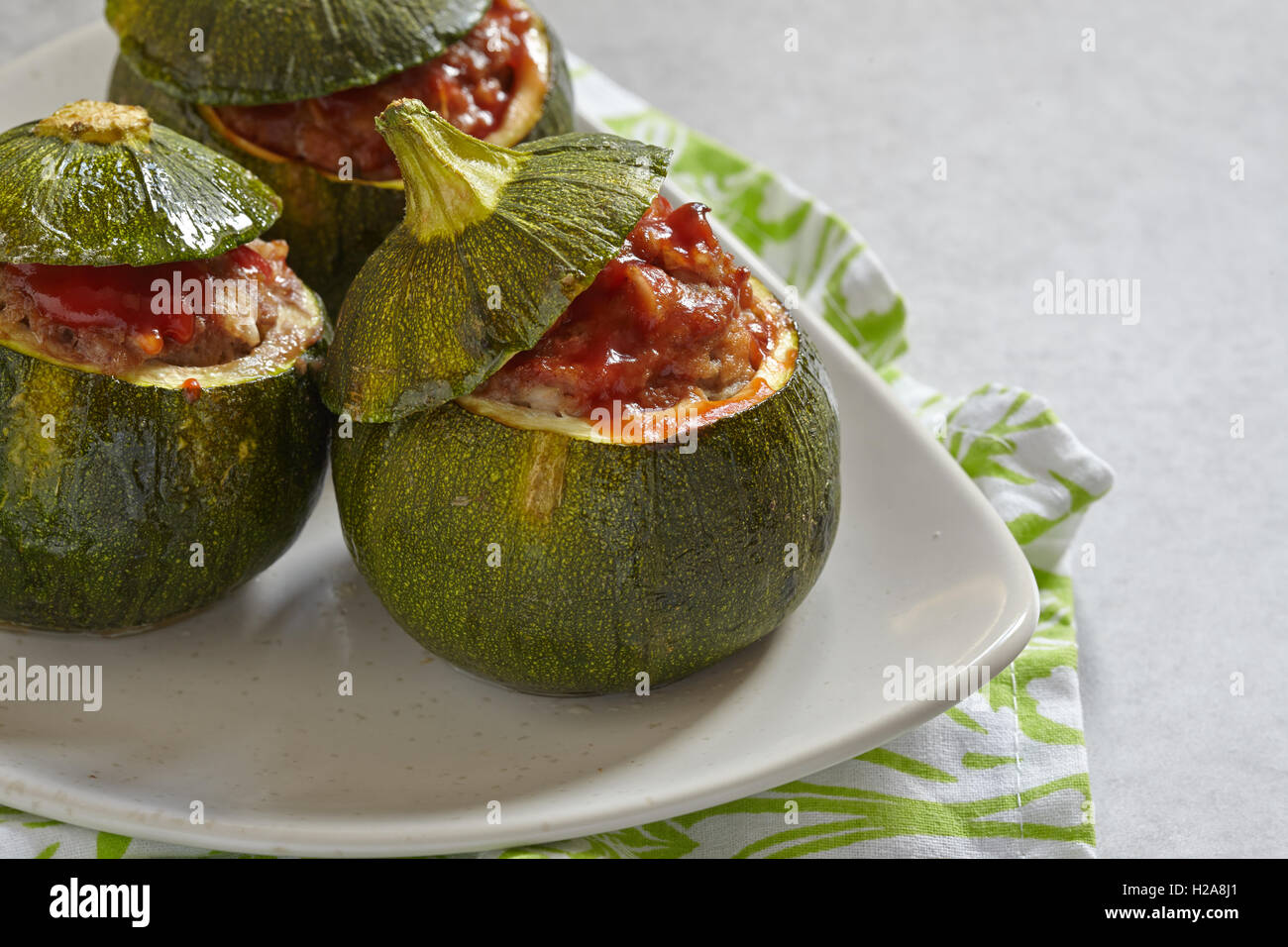 Eight-Ball zucchini stuffed with meat Stock Photo - Alamy