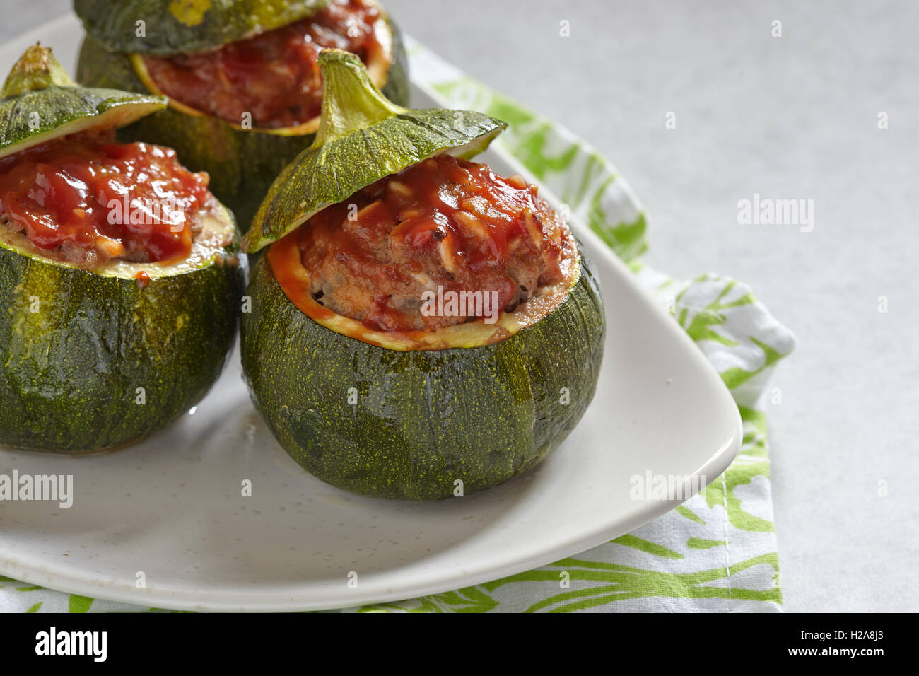 Eight-Ball zucchini stuffed with meat Stock Photo - Alamy