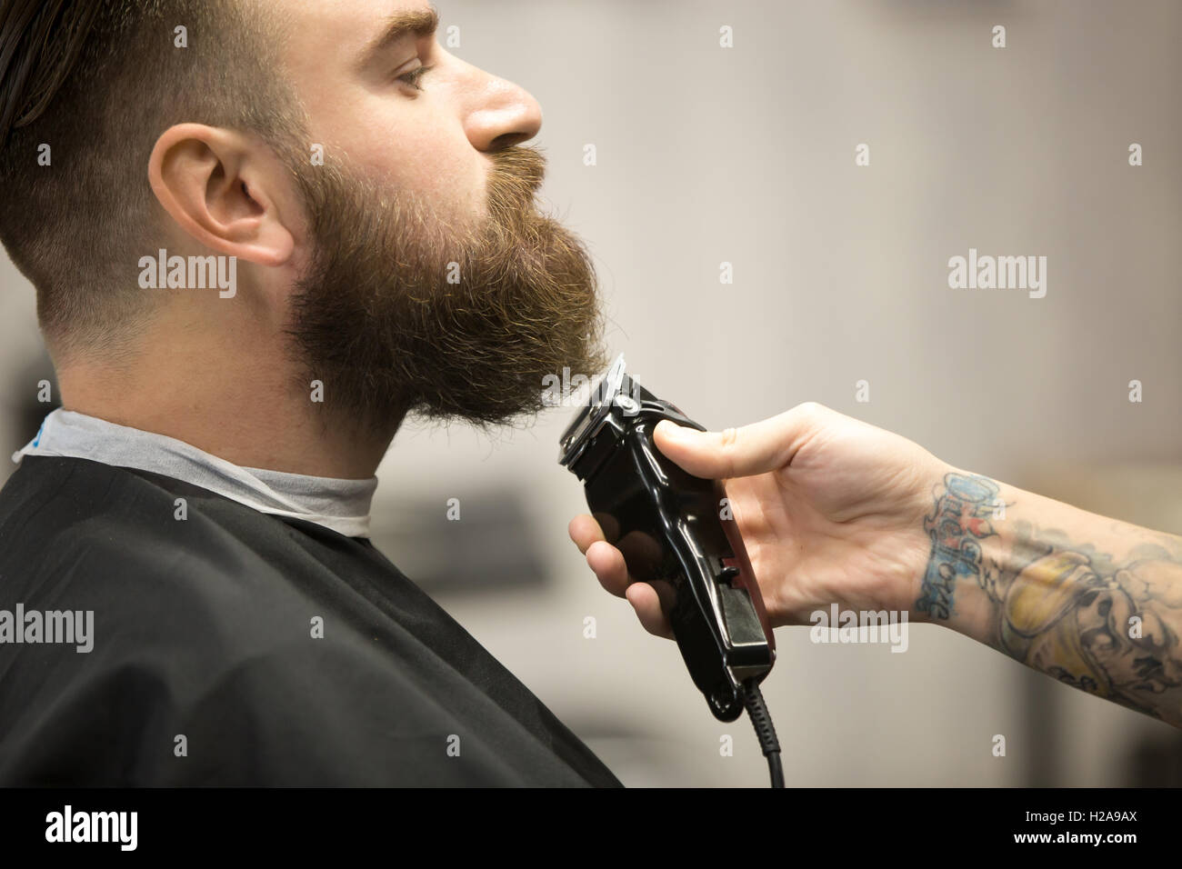 Close-up side view portrait of handsome young bearded caucasian man ...