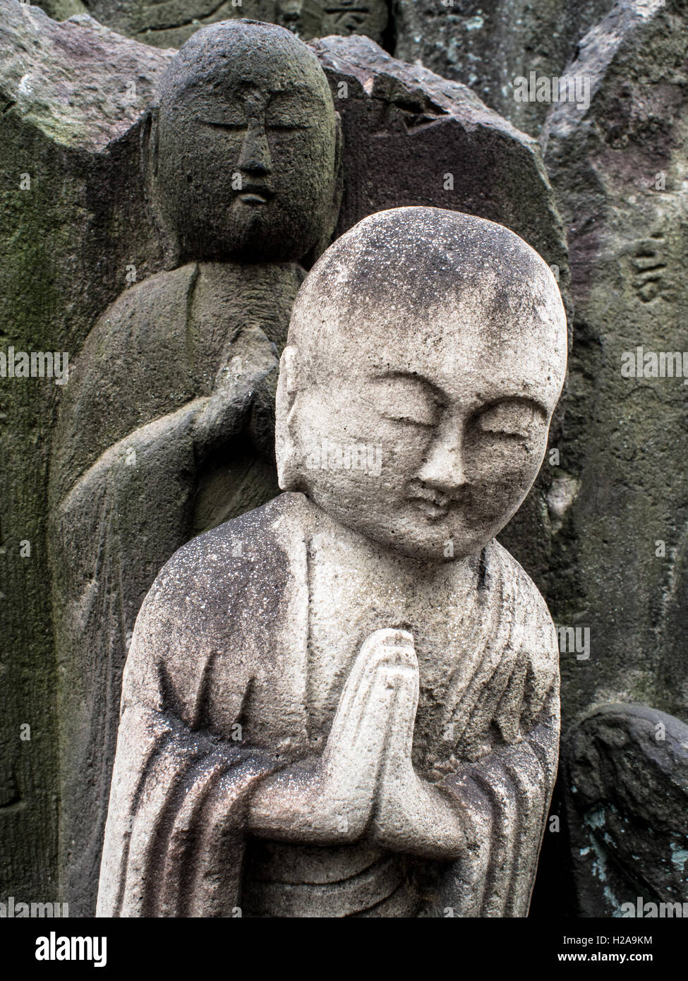 buddhist saints praying, statues in cemetery, temple in Koshikawa ...