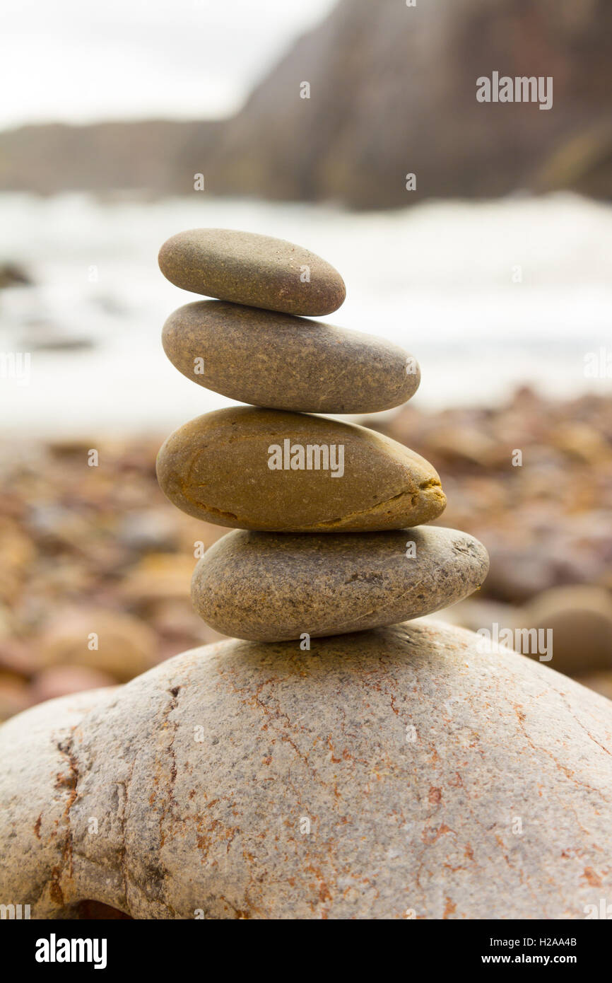 Round sea stones on top of each other Stock Photo - Alamy