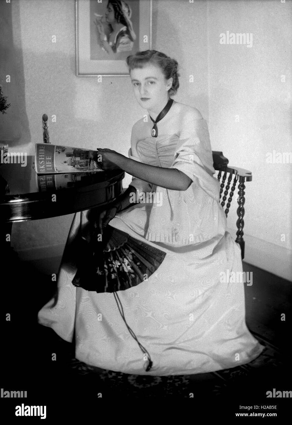 An elegant young woman reading a copy of Yorkshire Life Magazine ...