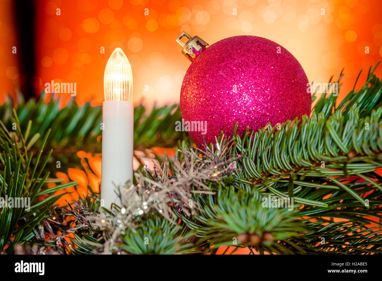 Christmas lights and a bauble on a tree Stock Photo - Alamy