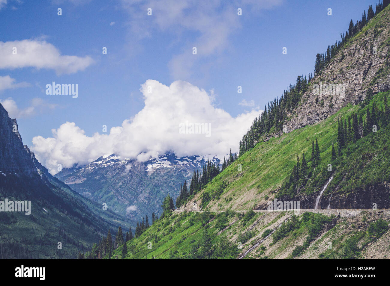 Landscape with green hills and snow on the mountains Stock Photo - Alamy