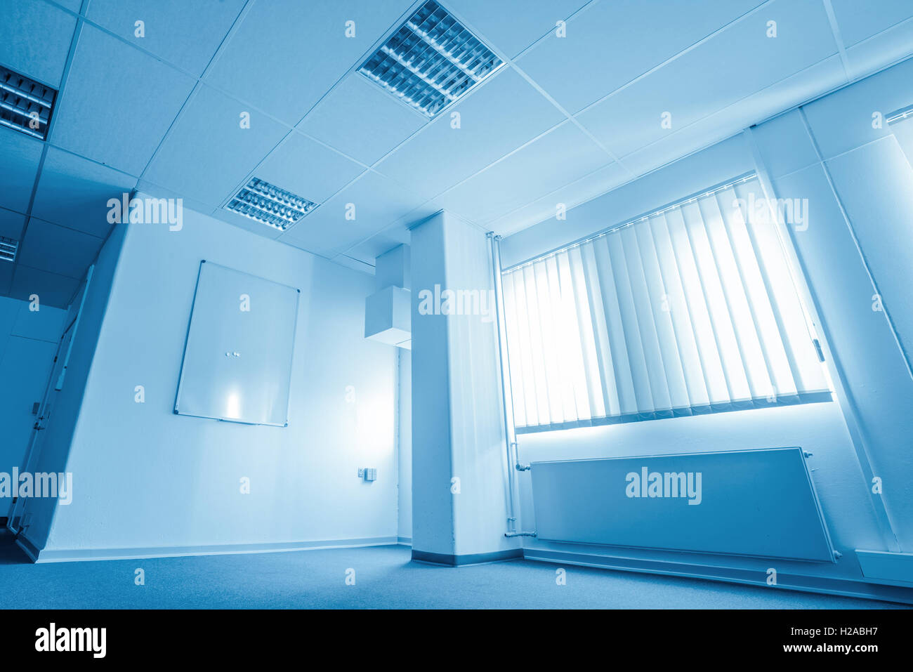 Office room in blue tone in daylight Stock Photo - Alamy