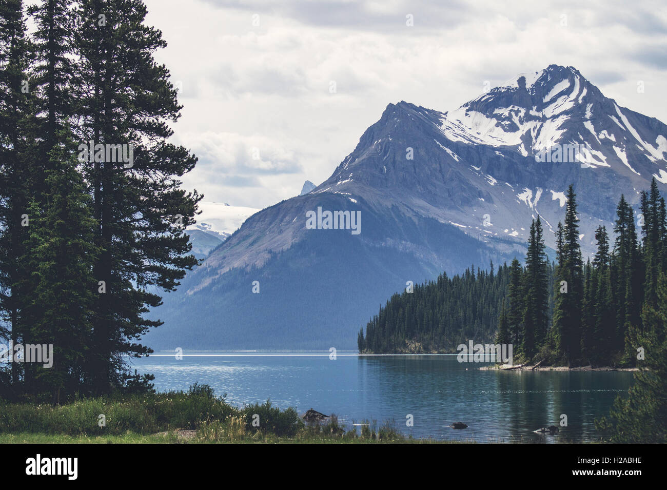 Beautiful lake landscape with mountain peaks and snow Stock Photo - Alamy