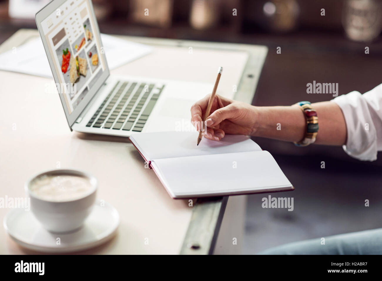 Female hand writing cooking recipe Stock Photo - Alamy